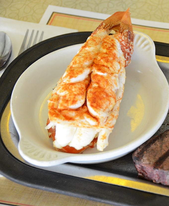 The lobster tail arrives like royalty in its shell, perfectly seasoned and ready to transport you to coastal bliss from America's Dairyland.