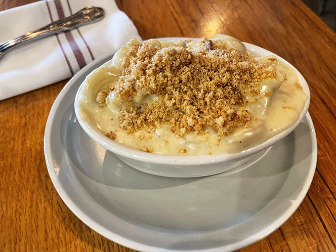 The crown jewel that launched a thousand road trips. Golden breadcrumbs atop molten cheese&mdash;this isn't just mac and cheese, it's edible therapy.