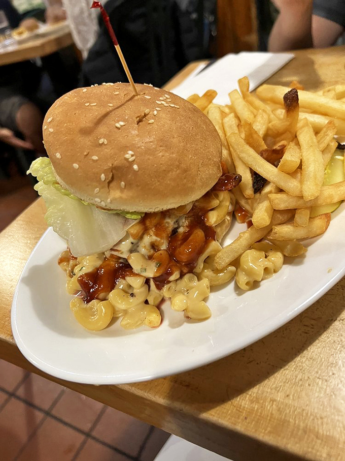 The mac and cheese burger defies both gravity and conventional taste boundaries. It's comfort food having an identity crisis in the most delicious way possible.