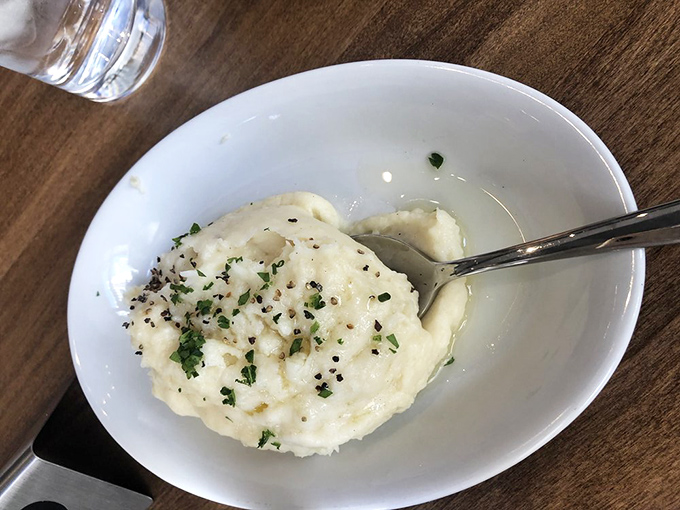 Cloud-like mashed potatoes that deserve their own zip code. Creamy, buttery, and flecked with herbs &ndash; the perfect landing pad for juices from your next meat selection.
