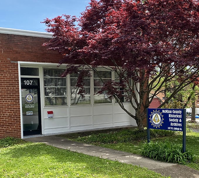 Behind that vibrant Japanese maple lies the McMinn County Historical Society, where yesterday's treasures await today's curious minds.