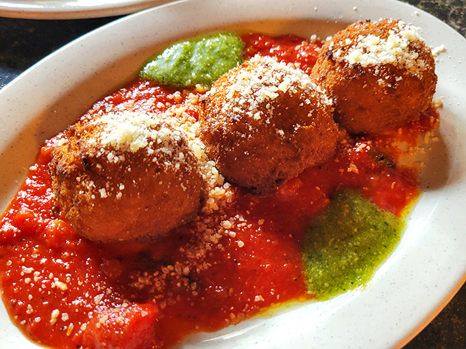 These aren't your average meatballs. Perfectly seasoned, nestled in bright marinara with pesto accents&mdash;they're little orbs of joy that grandmother would approve of.