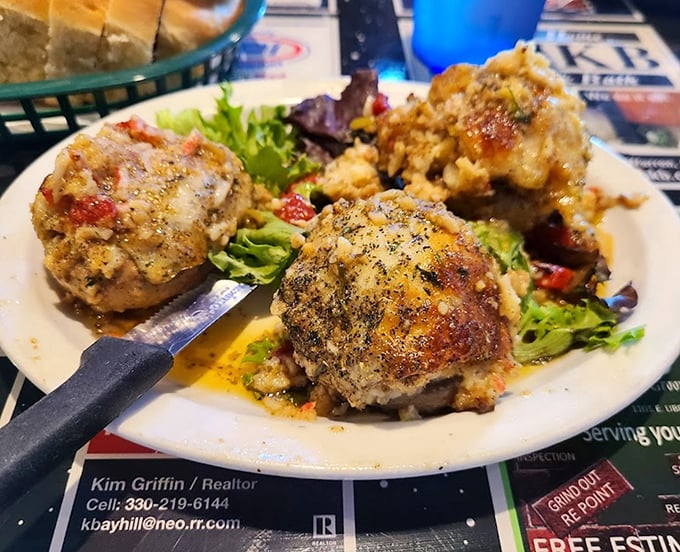 These meatballs aren't just spheres of meat; they're little planets of flavor orbiting around the sun of Italian culinary tradition.