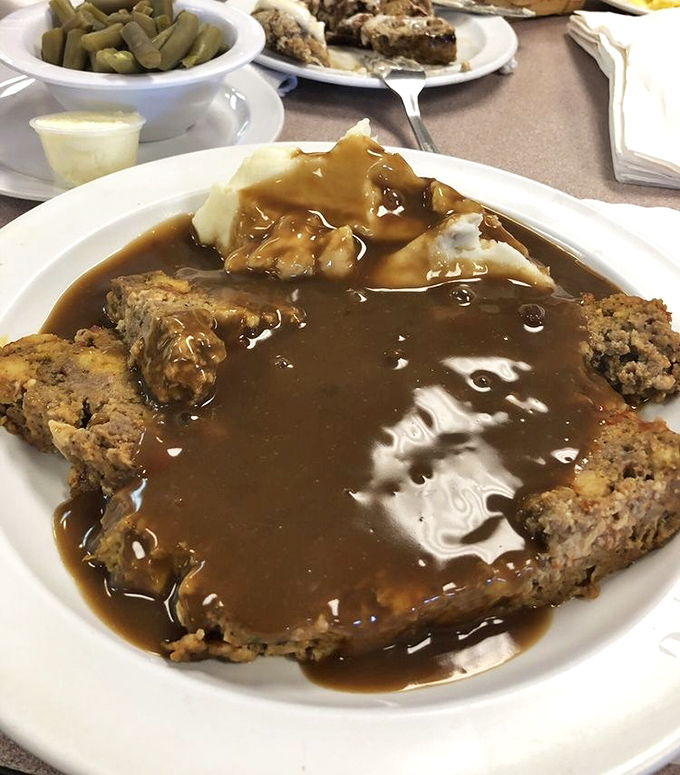 Behold the meatloaf in all its glory &ndash; tender, hearty, and smothered in gravy that would make your grandmother weep with joy.