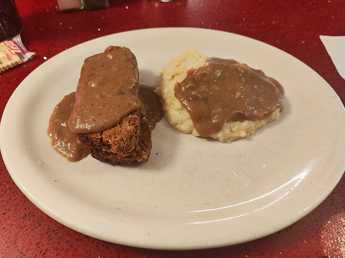 Behold the meatloaf in all its gravy-drenched glory! This isn't just dinner&mdash;it's edible therapy after a long New England day.