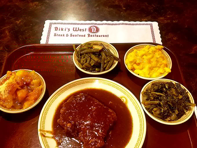 The meatloaf at Niki's West doesn't need fancy plating or garnish&mdash;just four perfect vegetable sides that prove Southern veggies deserve their own hall of fame.