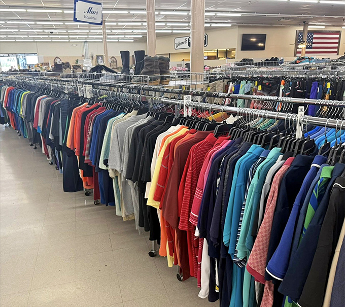The men's clothing section stretches toward the horizon like a rainbow of second chances. That vintage leather jacket is calling your name!