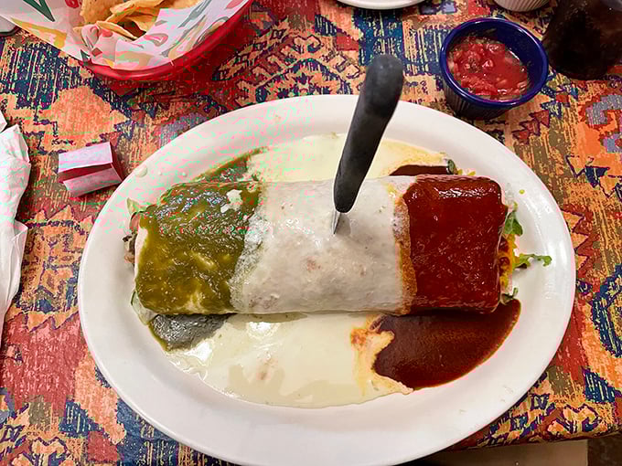 The Mexico City Burrito arrives like the flag of deliciousness&mdash;green sauce, white tortilla, and red sauce forming a patriotic tribute to flavor.