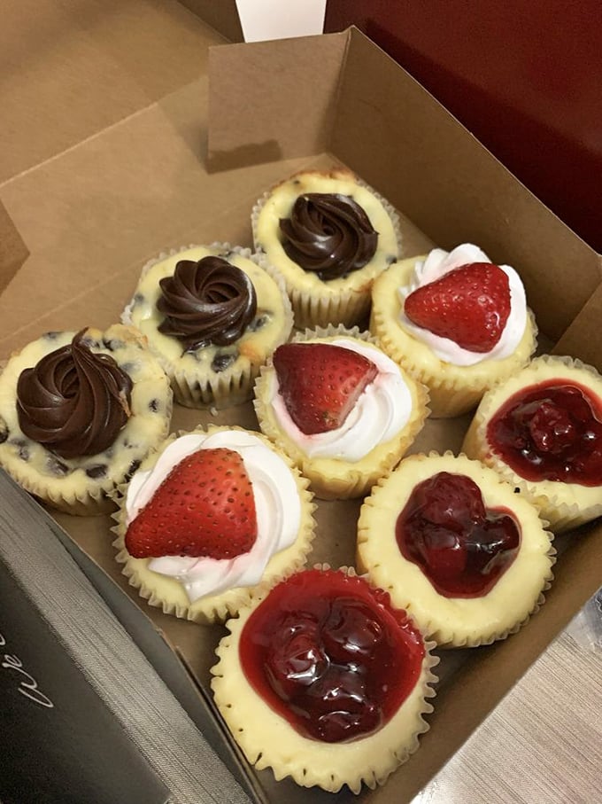 A box of mini cheesecakes that proves good things come in small packages. Chocolate swirls and fresh strawberries transform these bites into a celebration on your taste buds.