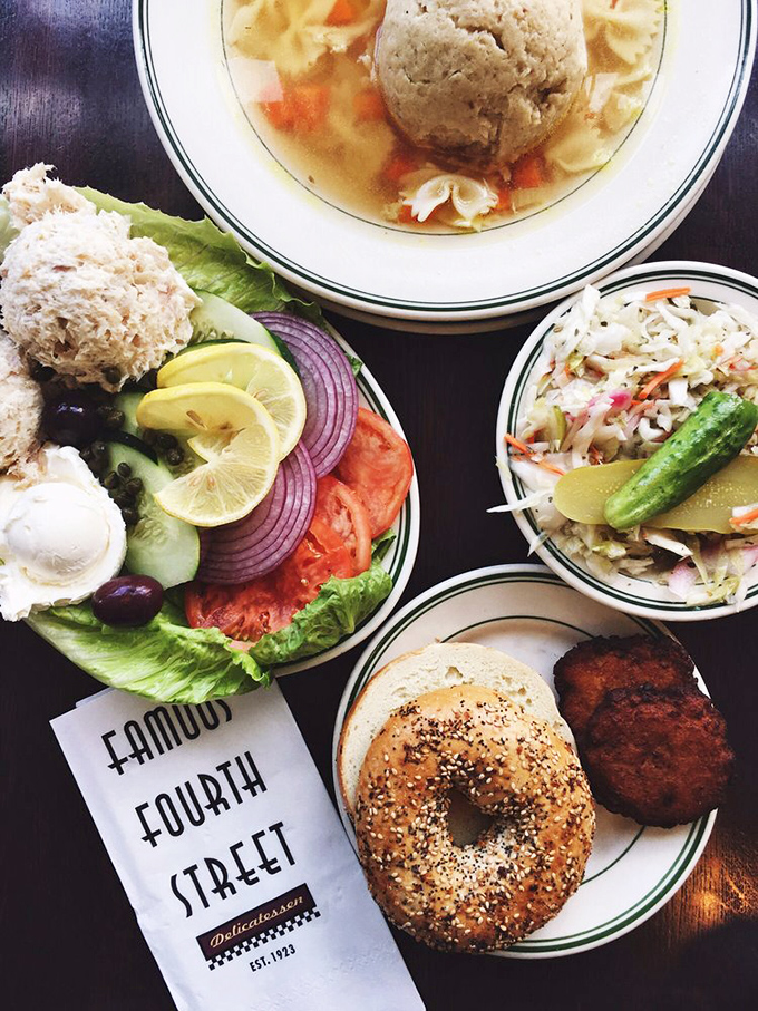 A feast for both eyes and stomach: matzo ball soup, whitefish salad, coleslaw, and a bagel that would make any New Yorker nod in respect.