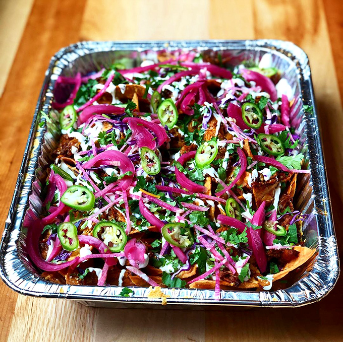 A fiesta of colors and textures&mdash;bright pickled onions, fresh jalape&ntilde;os, and herbs dance atop perfectly layered chips. Nacho average appetizer!