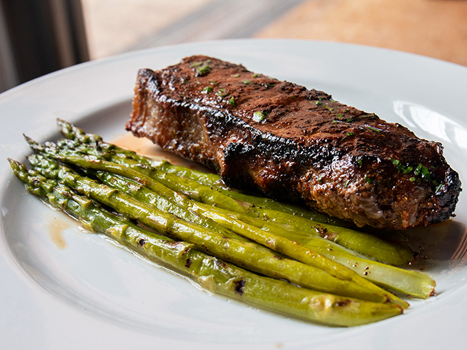 A perfectly seared New York strip with asparagus&mdash;proof that simplicity, when executed flawlessly, creates the most profound food memories.