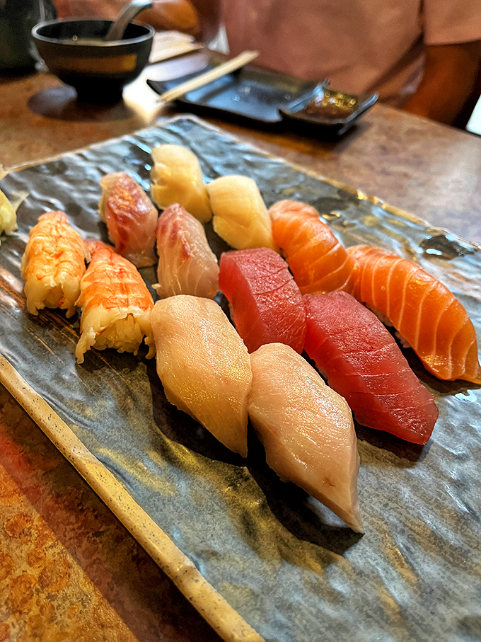 Nigiri perfection &ndash; each piece a testament to the chef's precision. The fish glistens like it's still contemplating its life choices.