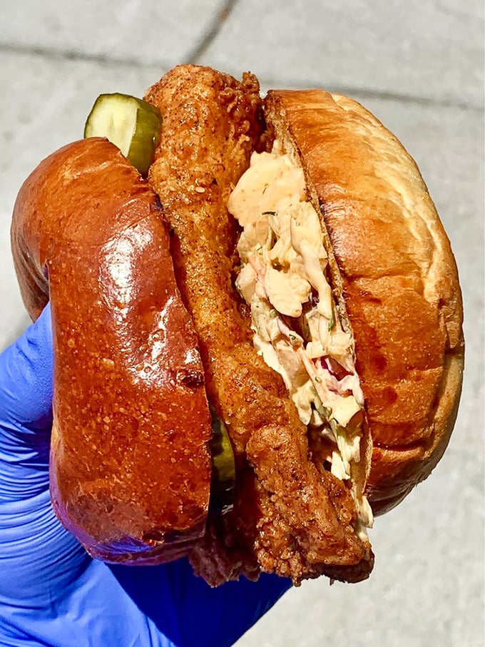 The OG Chicken Sandwich: architectural perfection between brioche. That gloved hand is about to deliver someone to their happy place. 