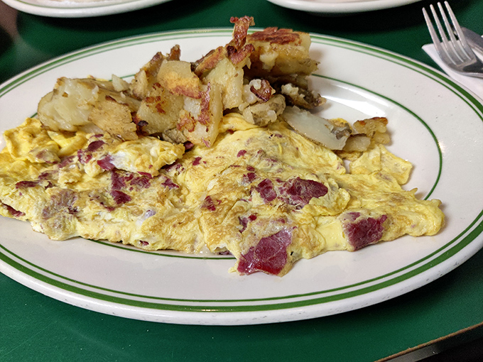 This omelet doesn't just contain ham&mdash;it celebrates it. Those home fries aren't side characters; they're co-stars in this breakfast drama.