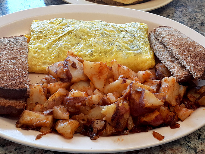 This omelet doesn't need filters or fancy plating&mdash;just perfectly cooked eggs, crispy home fries, and toast that's actually buttered all the way to the edges.