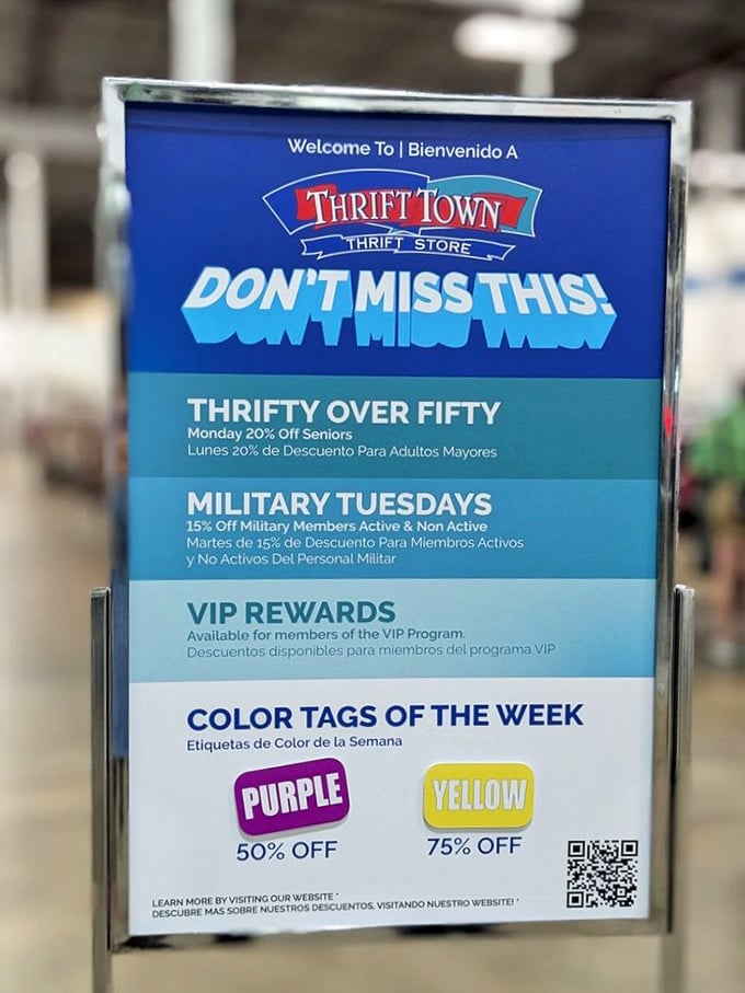 A sign that doesn't just announce discounts but practically sings them. Purple tags at 50% off? Yellow at 75%? That's not math—that's poetry.