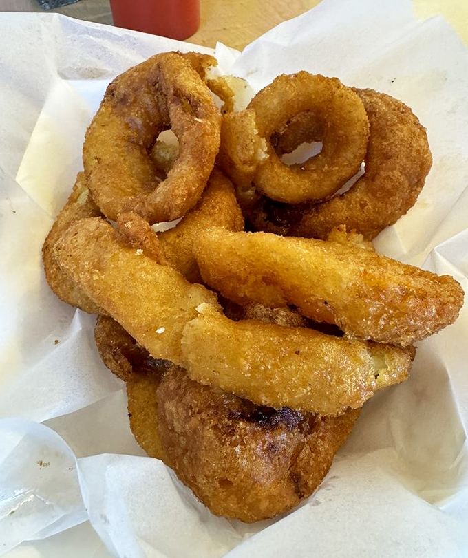 Golden-brown onion rings that shatter with each bite, revealing sweet, tender onion within. The perfect supporting actor to any meal.