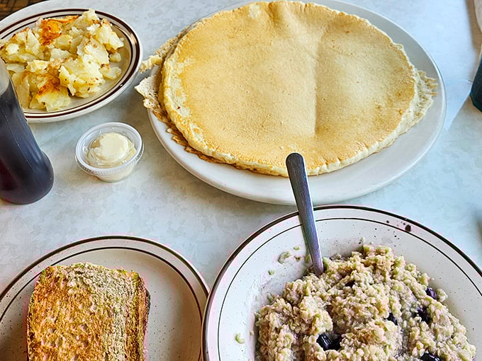 This pancake stretches to the edge of the plate like manifest destiny, with a side of oatmeal standing by for those with more sensible ambitions.