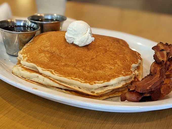 Stack 'em high, serve 'em proud. These pancakes with their crispy-edge bacon sidekick are the breakfast equivalent of hitting the lottery on a Monday morning.
