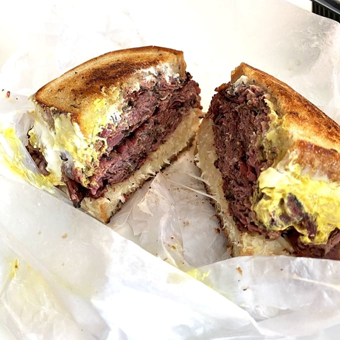 The Reuben, sliced open to reveal its glorious layers. Like a geological cross-section of deliciousness that would make any scientist drool.