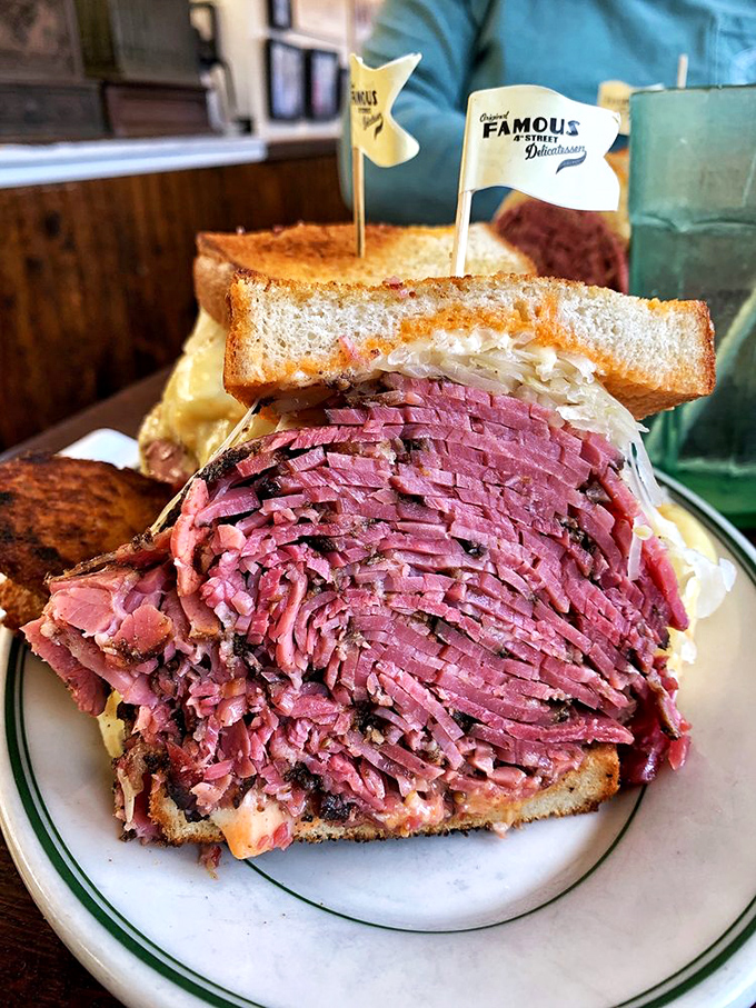 The pastrami at Famous 4th doesn't just melt in your mouth; it throws a flavor party and invites all your taste buds. That little flag isn't decoration&mdash;it's claiming territory.