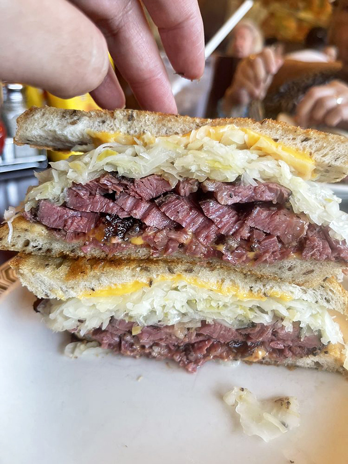 Layer upon glorious layer of hand-cut pastrami, the star of this show. One bite and you'll understand why people willingly stand in line for this meaty masterpiece.