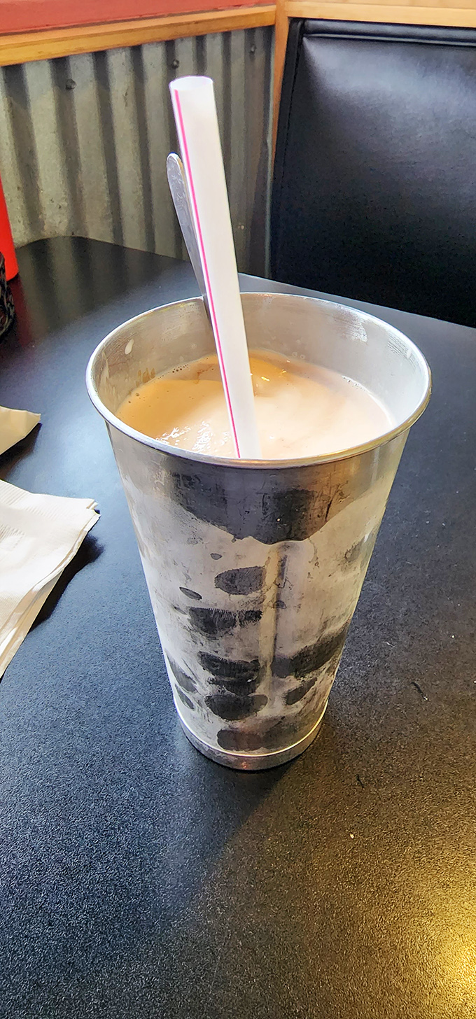 The metal mixing tin isn't just nostalgic—it's practical engineering. That extra milkshake waiting in the wings is like finding money in last year's coat pocket.