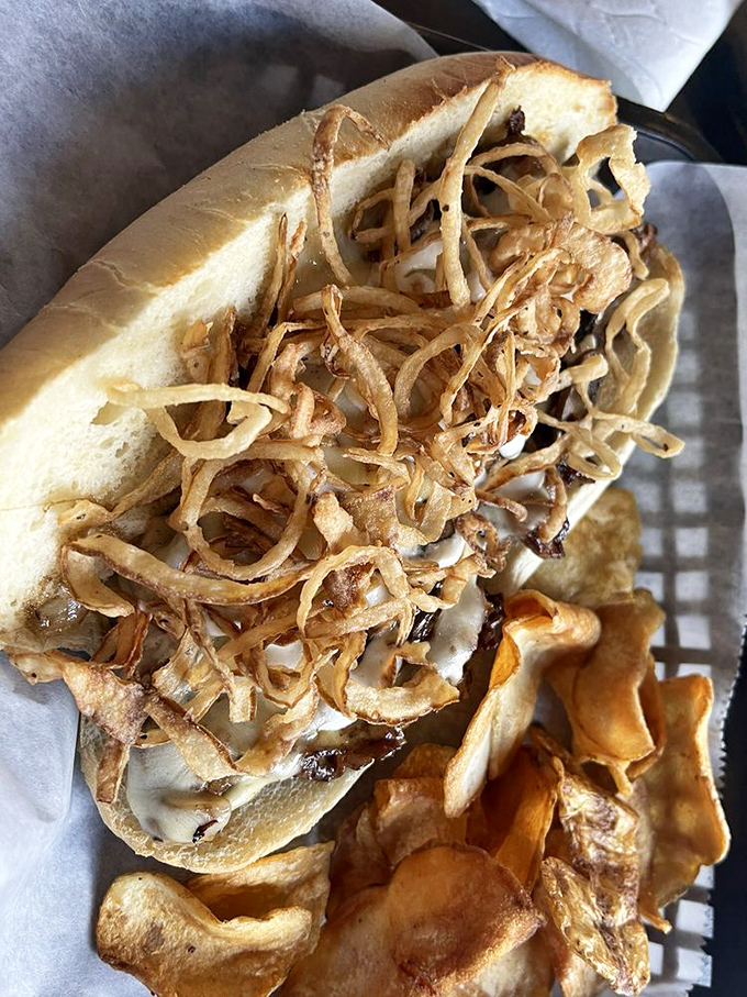 Not your average sandwich jailbreak&mdash;this creation piles crispy onion straws high enough to require a permit from the FAA.