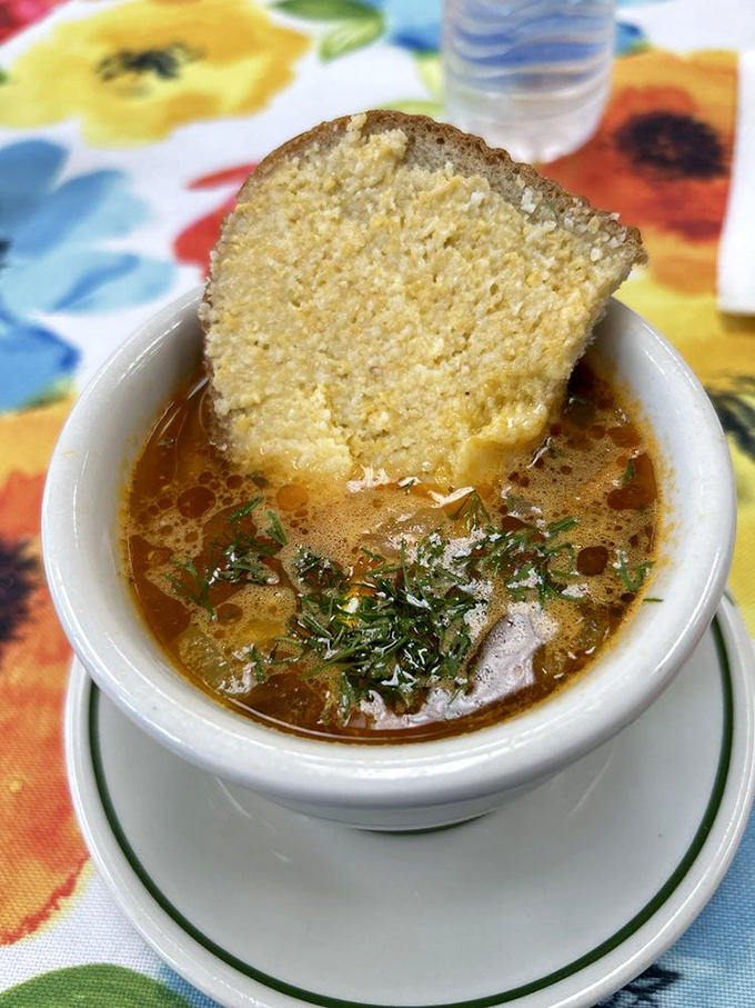 Soup that could make your grandmother jealous. A golden broth with a slice of cornbread that's practically begging to take a dive.