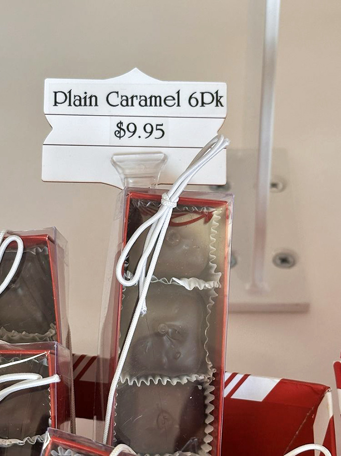 Plain caramels packaged with the elegance of fine jewelry. The white ribbon suggests sophistication; the contents promise pure indulgence.