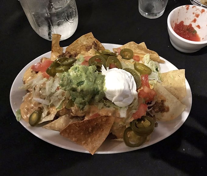 The nacho mothership has landed! Guacamole, sour cream, and jalape&ntilde;os create a flavor cosmos that's worth every messy bite.