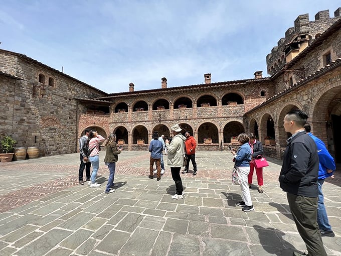 The courtyard where medieval architecture meets modern tourism. Notice nobody's checking their phone&mdash;the stone walls have that effect on people.