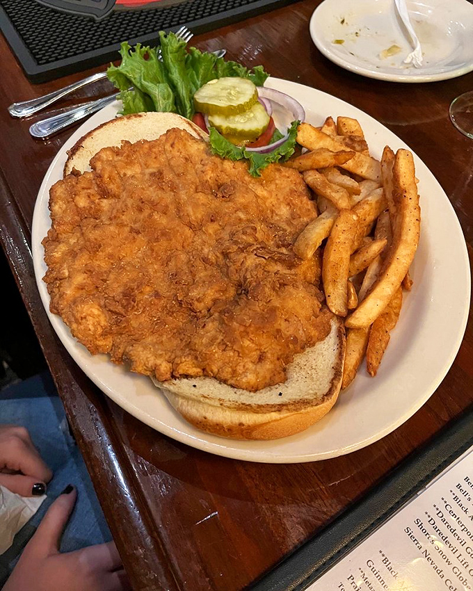 The pork tenderloin sandwich: Indiana's answer to "what if schnitzel had a midwestern makeover?" Gloriously oversized and unapologetically delicious.