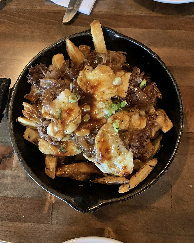 This isn't your average poutine&mdash;it's a skillet of rebellion where crispy fries, melty cheese, and savory pulled meat create a harmony that would make Mozart jealous.
