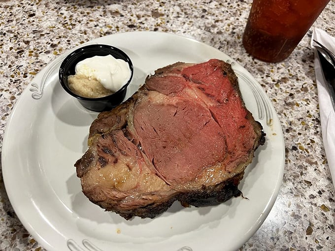 Prime rib so perfectly cooked it practically poses for its portrait, accompanied by a modest dollop of horseradish cream that packs a sinus-clearing punch.
