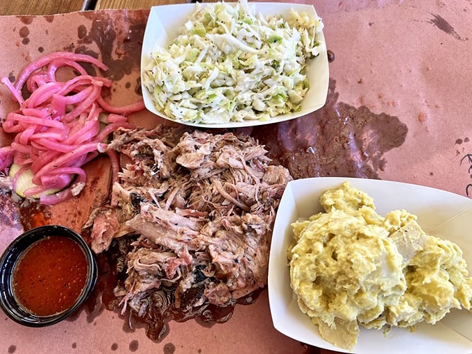 Pulled pork that surrenders completely to the fork, accompanied by crisp slaw and those magical pink pickled onions that cut through the richness.