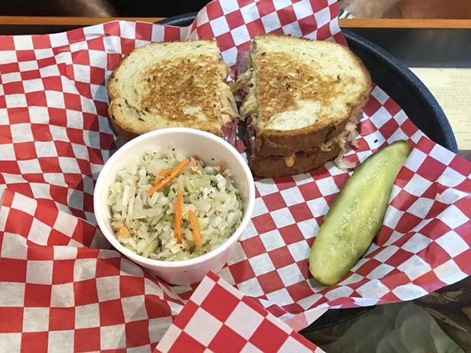 Classic presentation, extraordinary taste. This Reuben with house-made coleslaw and pickle spear is the sandwich equivalent of finding money in old jeans.