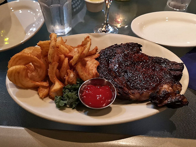 A steak with a sear that could make angels weep, paired with golden fries that crackle with each bite.