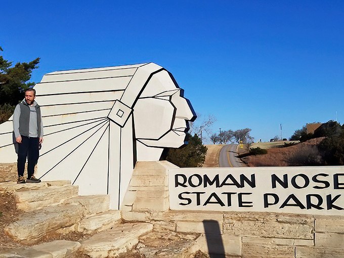Roman Nose State Park's iconic entrance stands as a gateway to affordable outdoor adventures&mdash;nature's entertainment complex with no subscription fees required.