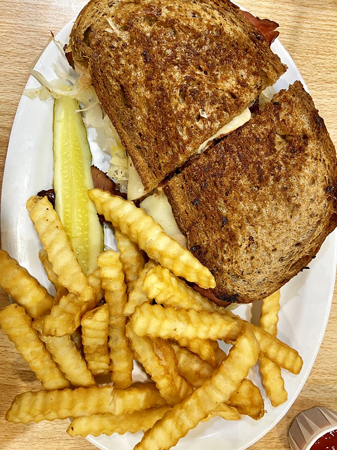 This Russian Reuben with crispy crinkle-cut fries isn't just lunch; it's a commitment to excellence that rewards your taste buds with every bite.