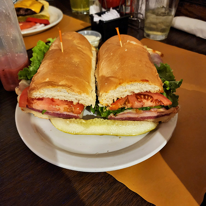 When a sandwich requires structural engineering and toothpicks to hold it together, you know you're in Pittsburgh. This isn't lunch&mdash;it's an event.