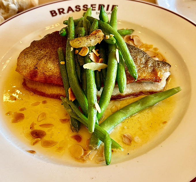 Crispy-skinned sea bass lounging in buttery sauce with green beans standing at attention&mdash;the French sure know how to make fish fabulous.