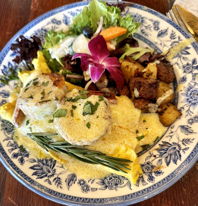 Breakfast artistry at its finest&mdash;where perfectly cooked eggs meet herb-roasted potatoes and that purple orchid isn't just pretty, it's saying "You chose wisely."