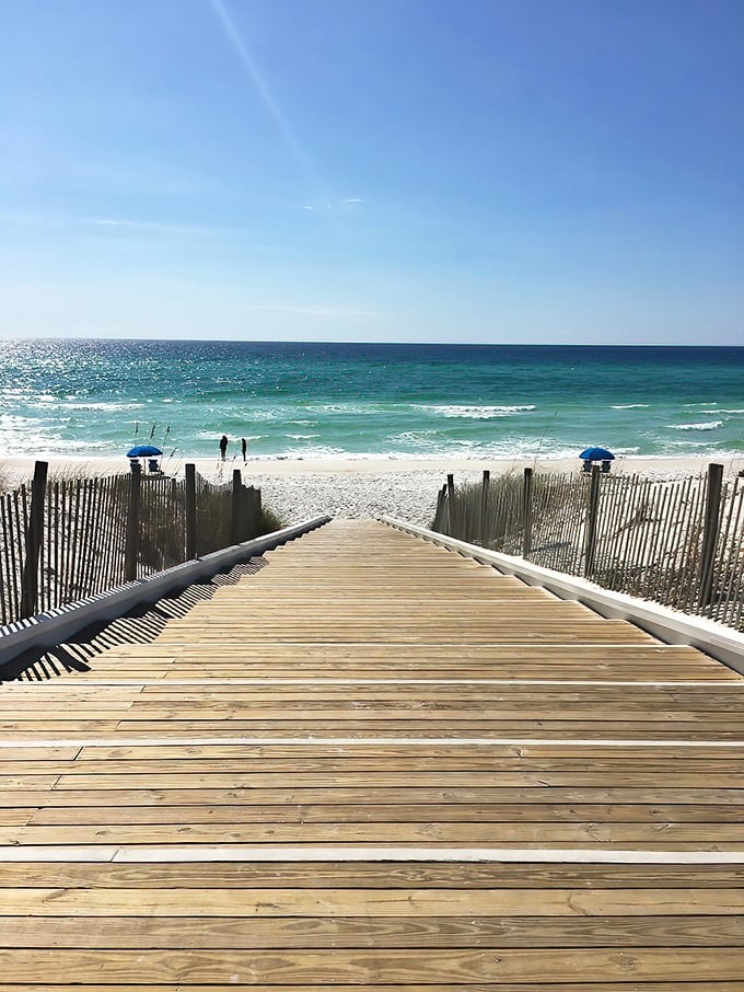 That wooden boardwalk practically begs you to kick off your shoes and feel the sugar-white sand between your toes.