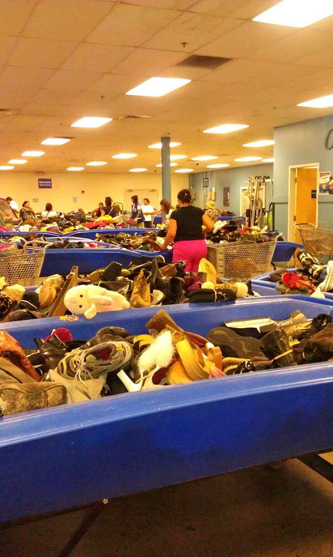 The thrill of the hunt in action! Shoppers carefully sift through mountains of possibilities, each with their own treasure-hunting technique perfected over countless visits. 