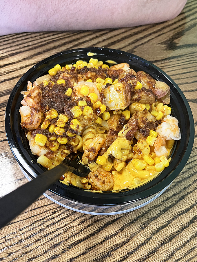 Seafood and mac unite in a bowl that would make Neptune himself abandon his trident for a fork.