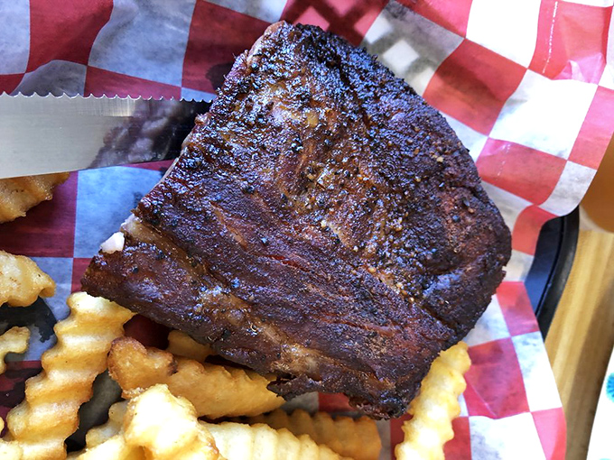 Ribs with a smoke ring so perfect it could teach geometry classes. The meat isn't falling off the bone&mdash;it's voluntarily departing with dignity.