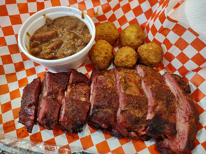 Behold the glory of perfectly smoked beef ribs with that signature pink ring and hushpuppies that could make a Southerner weep with joy.