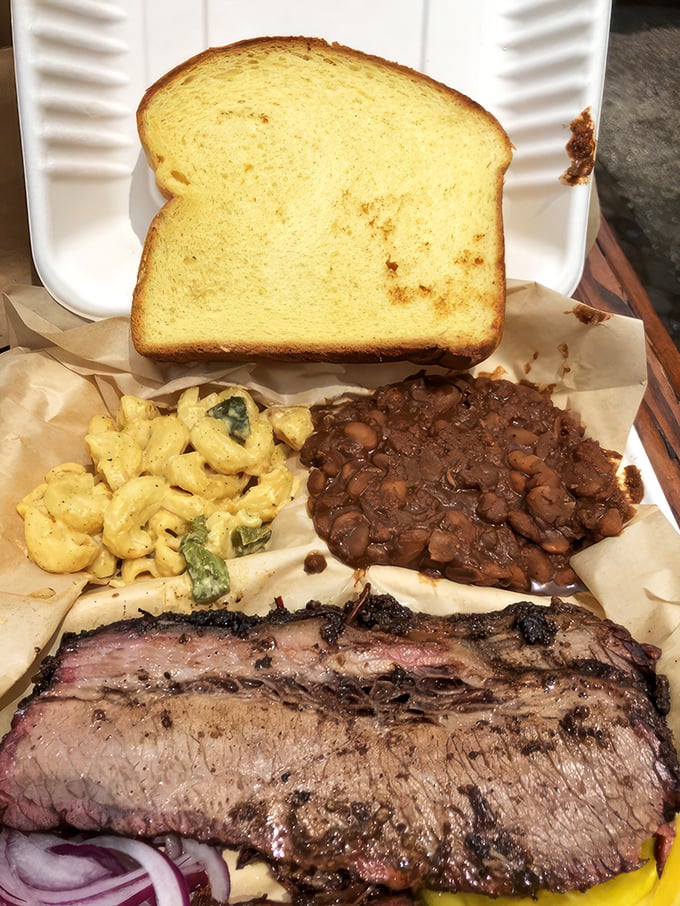 Brisket, beans, and mac and cheese: the holy trinity of comfort that proves paradise exists and it's served on butcher paper.